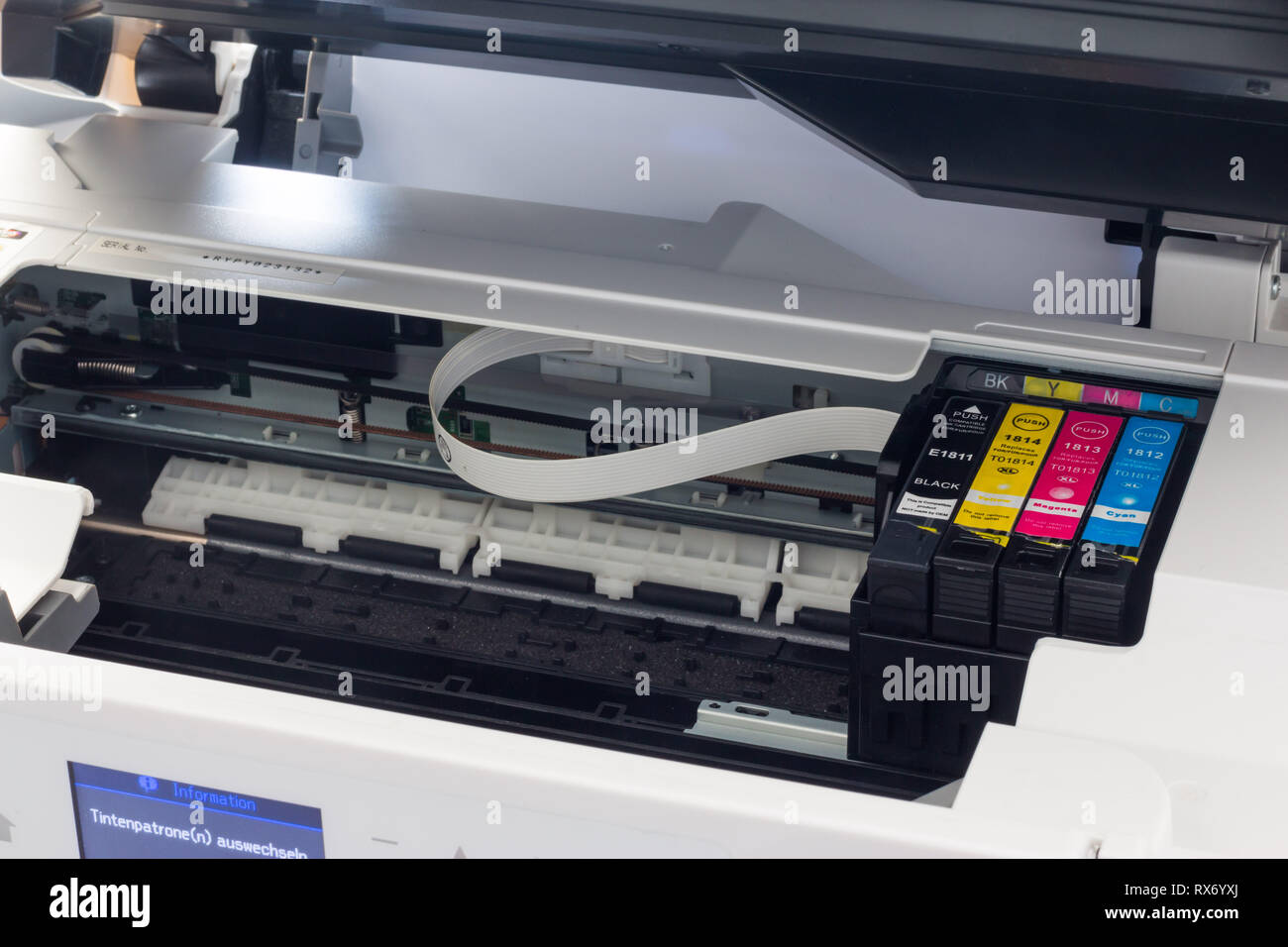 Putting new printer cartridge into the printer, inkjet Stock Photo - Alamy