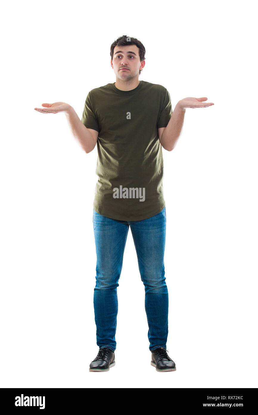 Full length portrait confused young man showing hands raised isolated ...