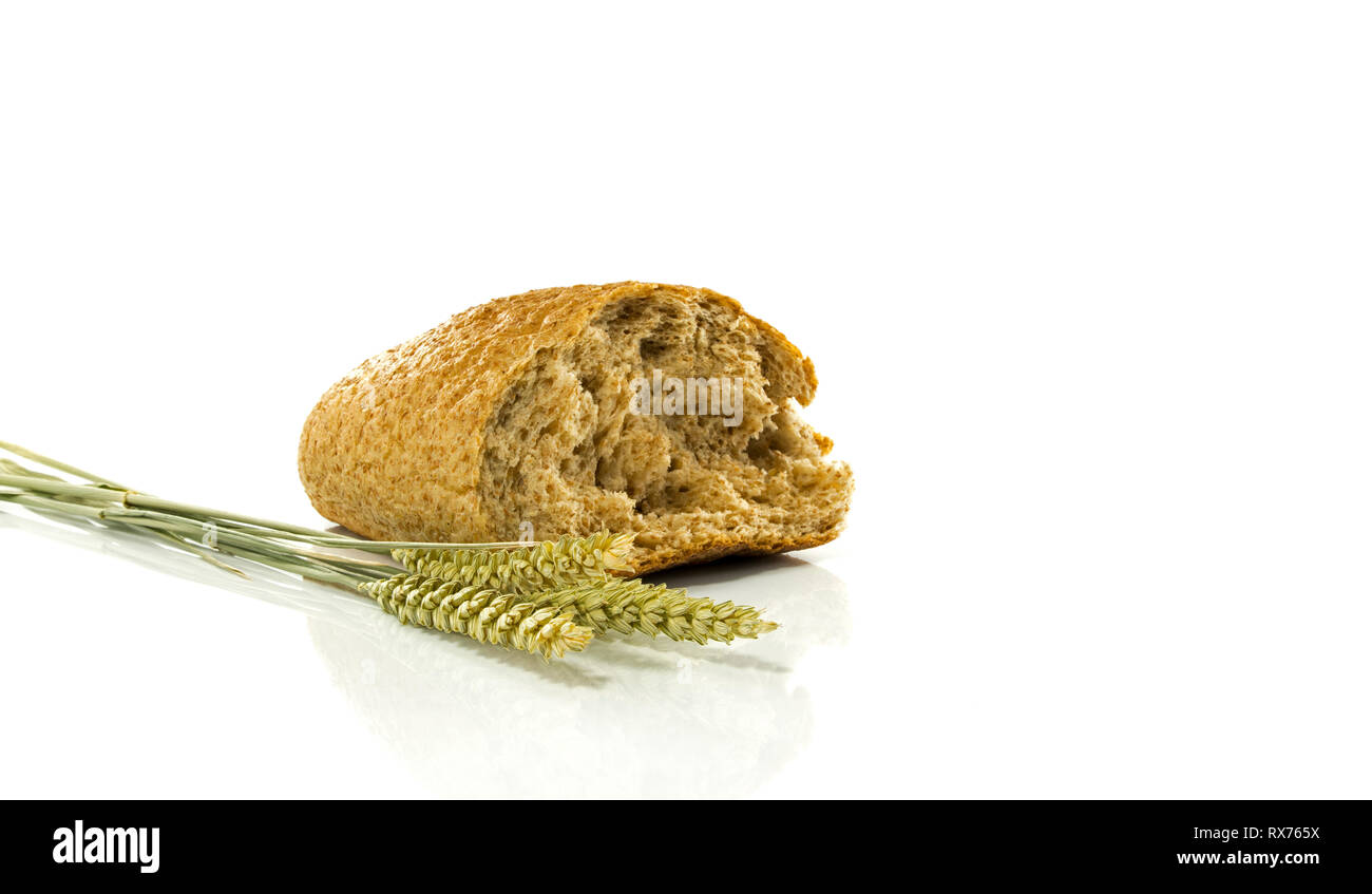 A wheat bread and shock of wheat on a white background Stock Photo - Alamy