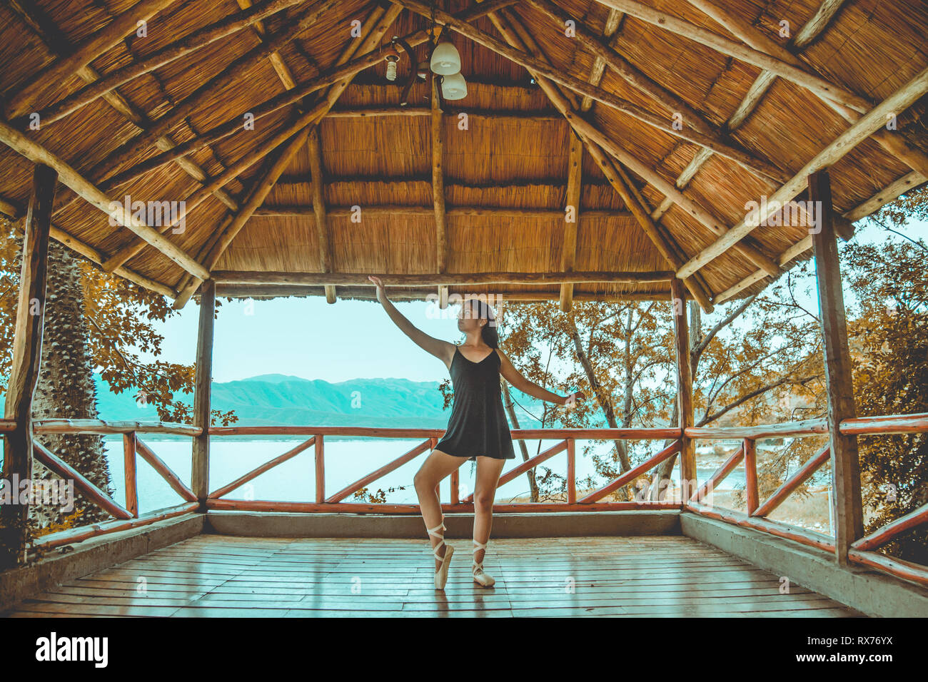 Young woman dancing in a garden Stock Photo - Alamy
