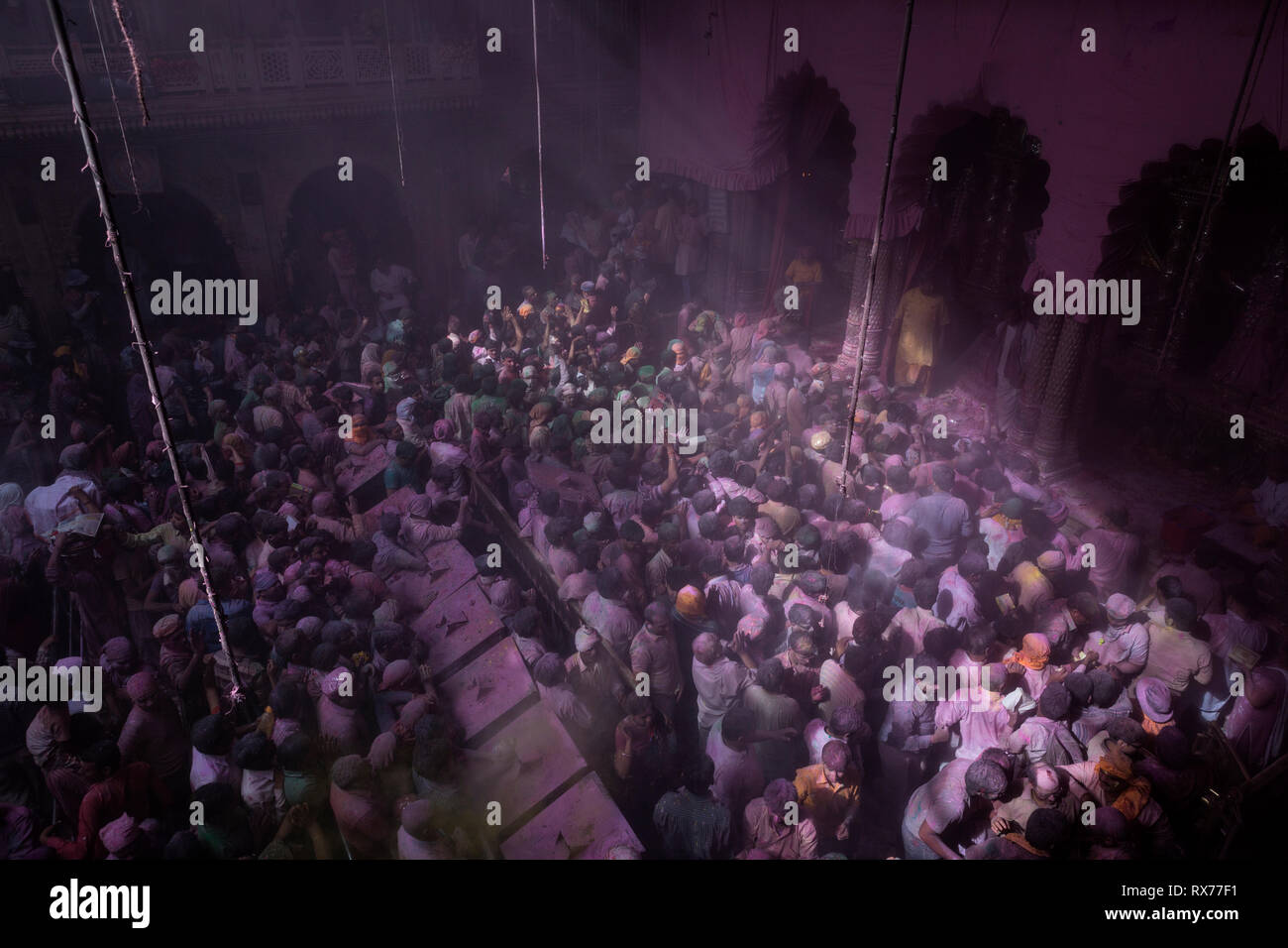 A large number of believers praying in front the image of Krishna ...