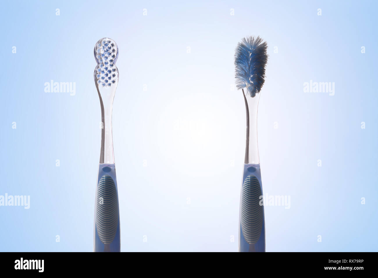 Comparison between new and used toothbrush with blue isolated ...