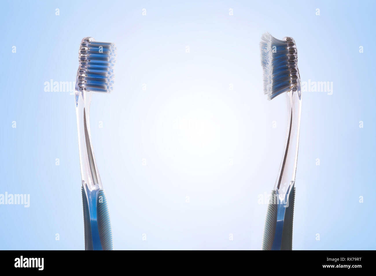 Comparison between new and used tooth brush facing off with blue ...