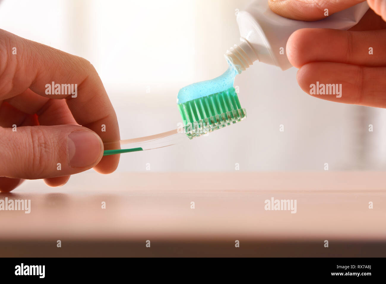 Putting Toothpaste On Toothbrush