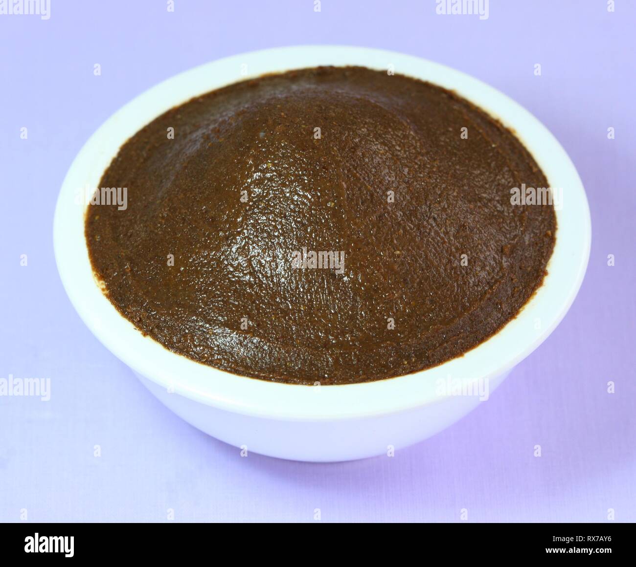 Shrimp paste in white bowl on white background Stock Photo - Alamy
