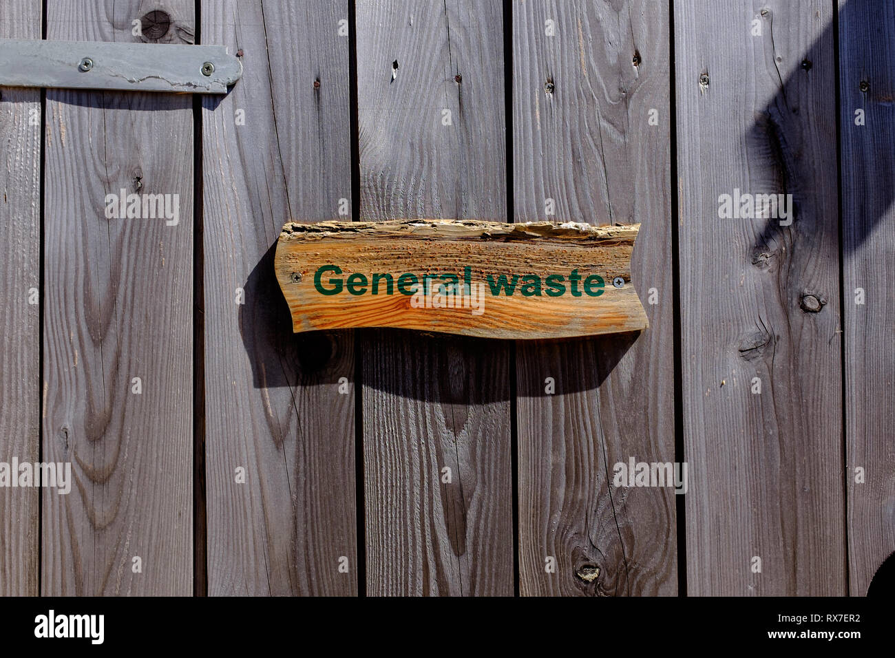 Recycling building with hand carved wooden information signs attached ...