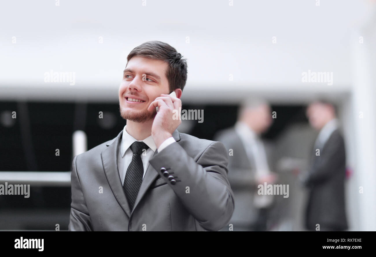 portrait of handsome businessman on blurred office background Stock ...