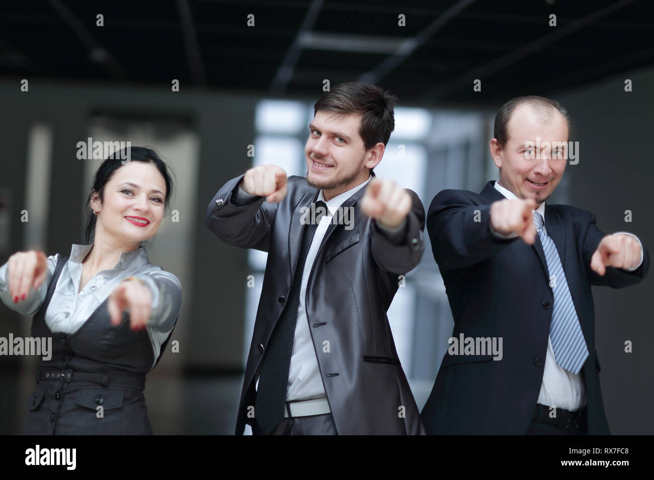 close up.successful business team pointing at you Stock Photo - Alamy