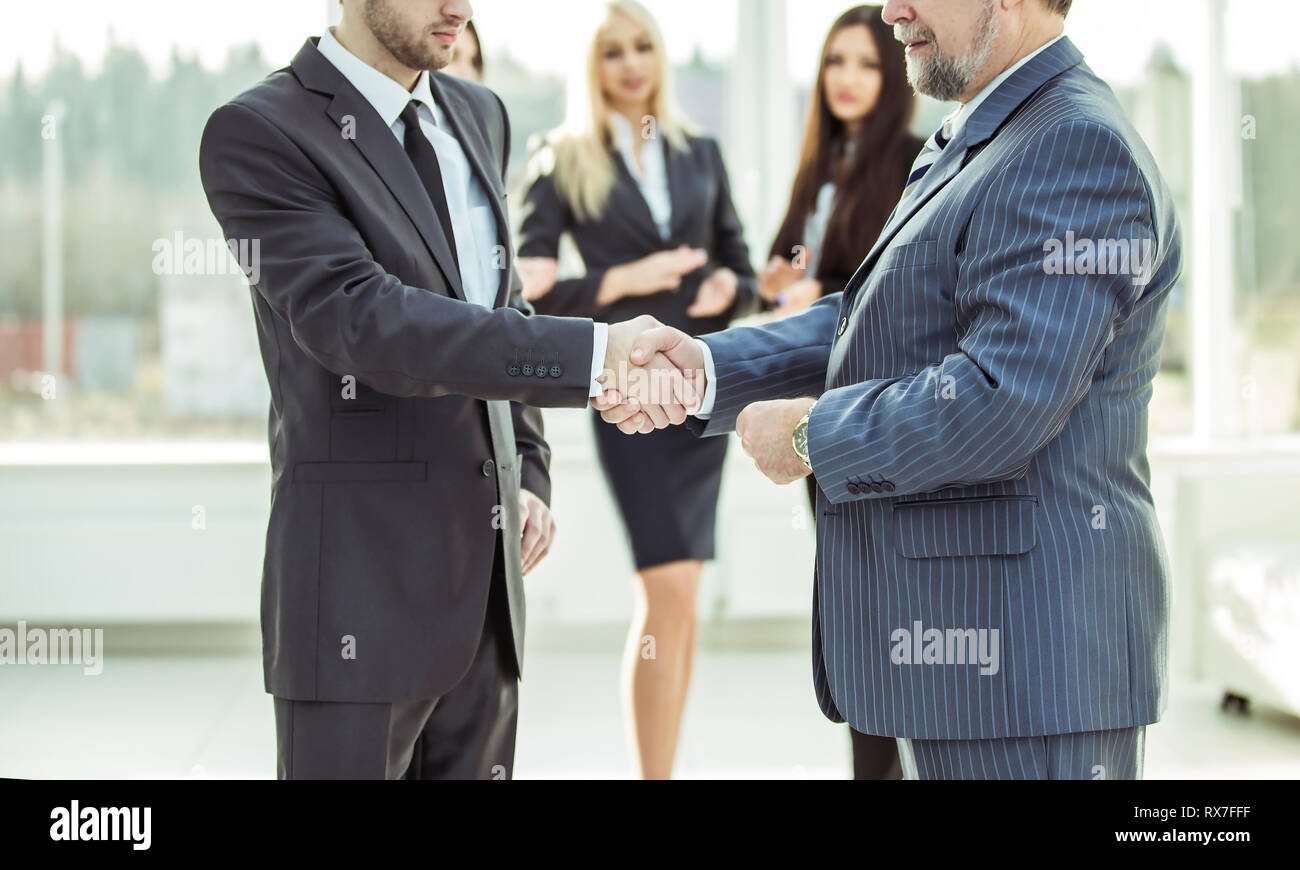 concept of cooperation - handshake of business partners on the ...