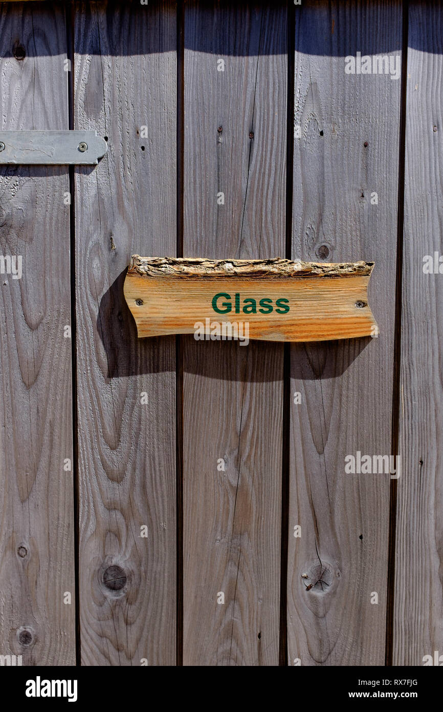 Recycling building with hand carved wooden information signs attached ...