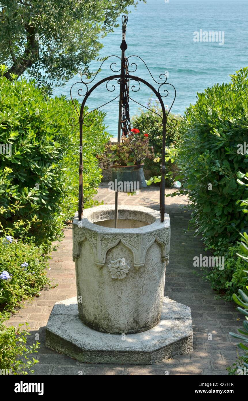 Water well in garden at Sirmione, located in the lake Garda, Italy ...