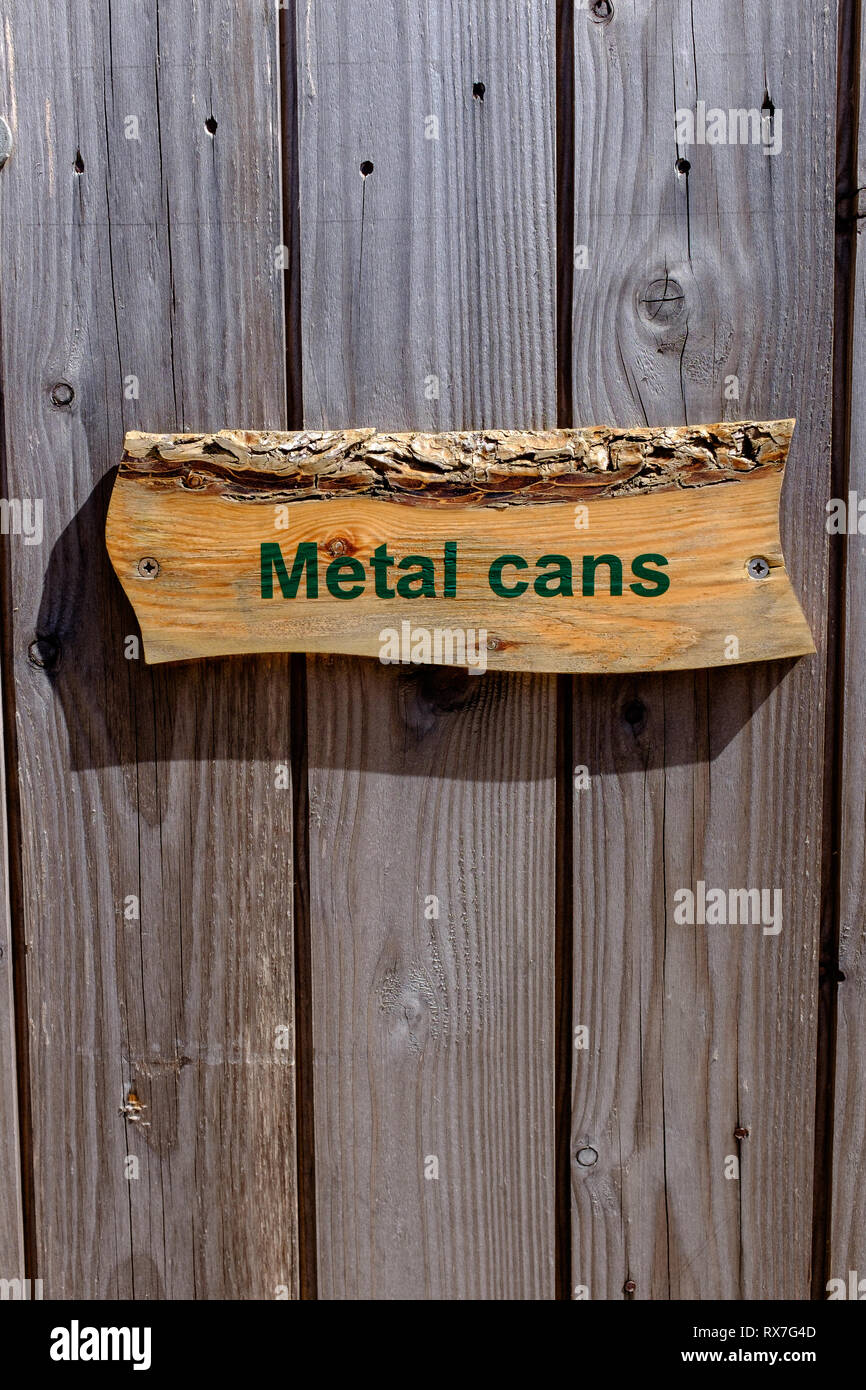 Recycling building with hand carved wooden information signs attached ...