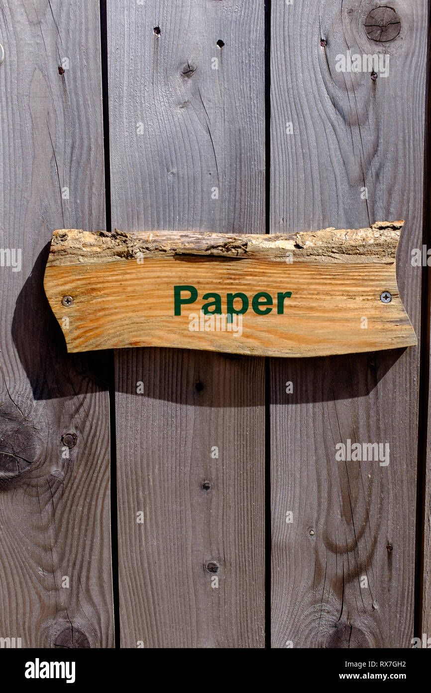 Recycling building with hand carved wooden information signs attached ...