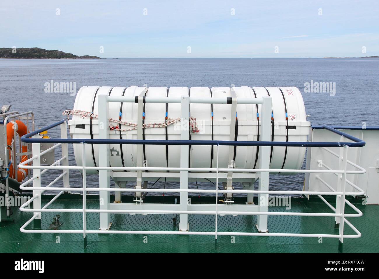 Life raft on a ferry in Norway. Inflatable liferaft in a hard shell ...