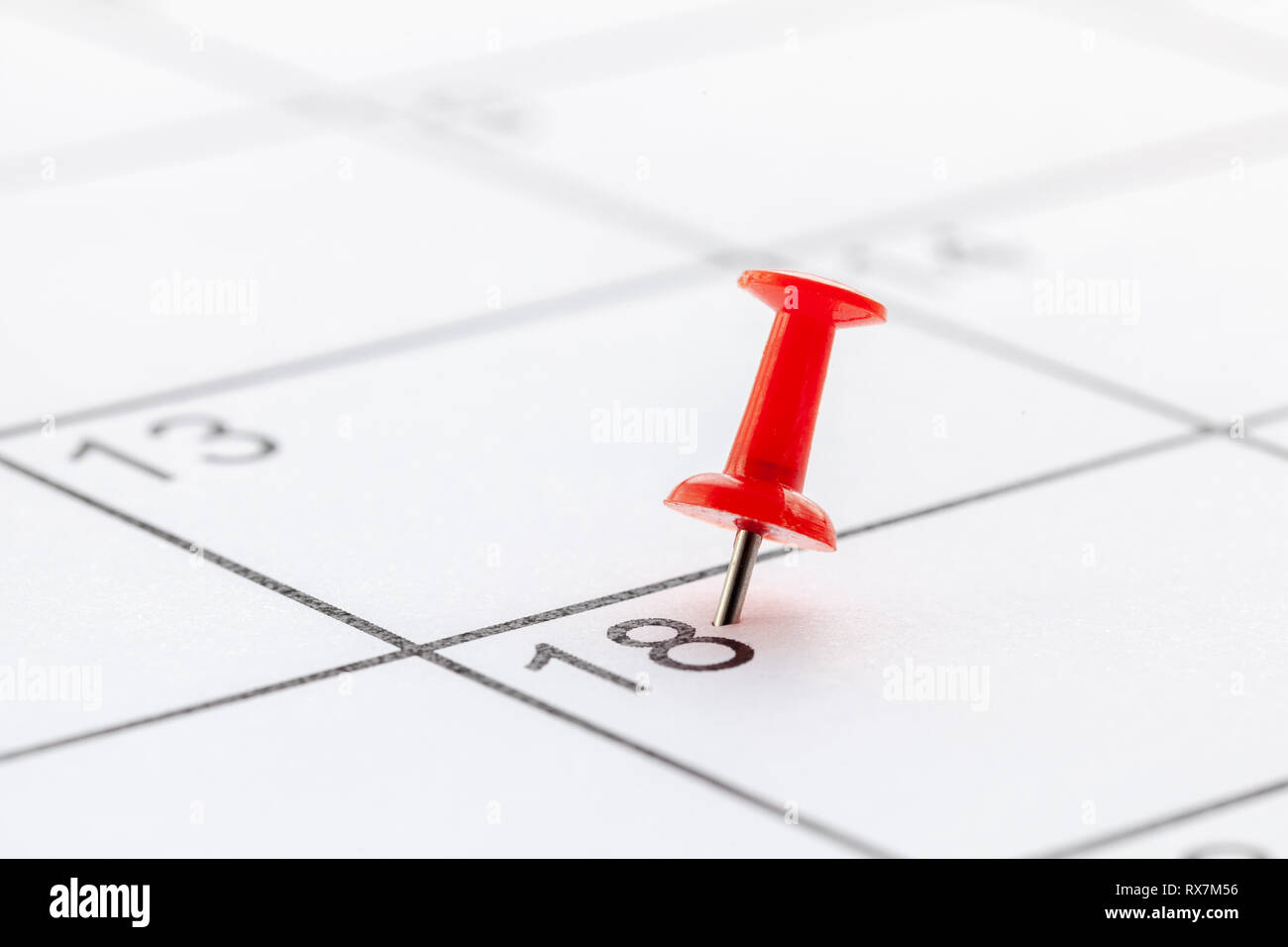 Red push pin on white calendar background. Copy space for text Stock ...