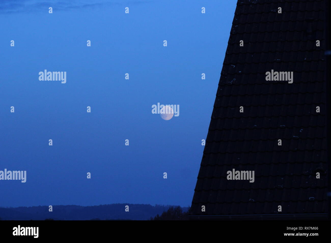 Evening Moon in the sky Stock Photo - Alamy