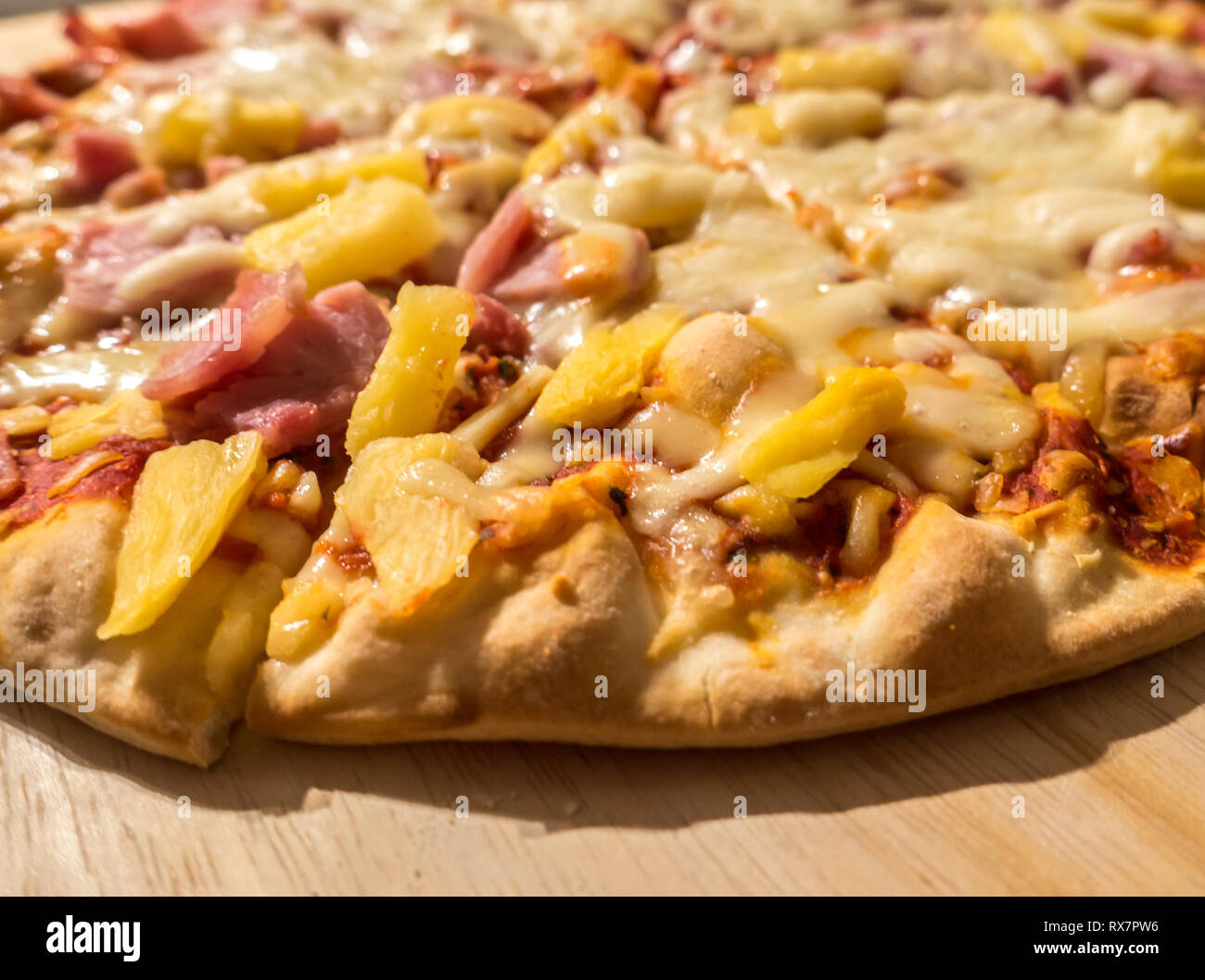 Hawaiian pizza with ham, pineapple and cheese Stock Photo - Alamy