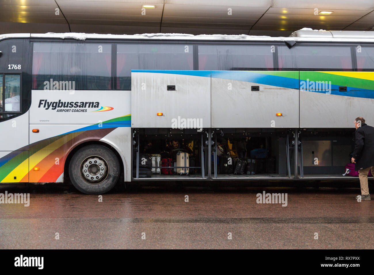 Editorial 12.17.2018 Stockholm Sweden, Bus with open doors to the cargo ...