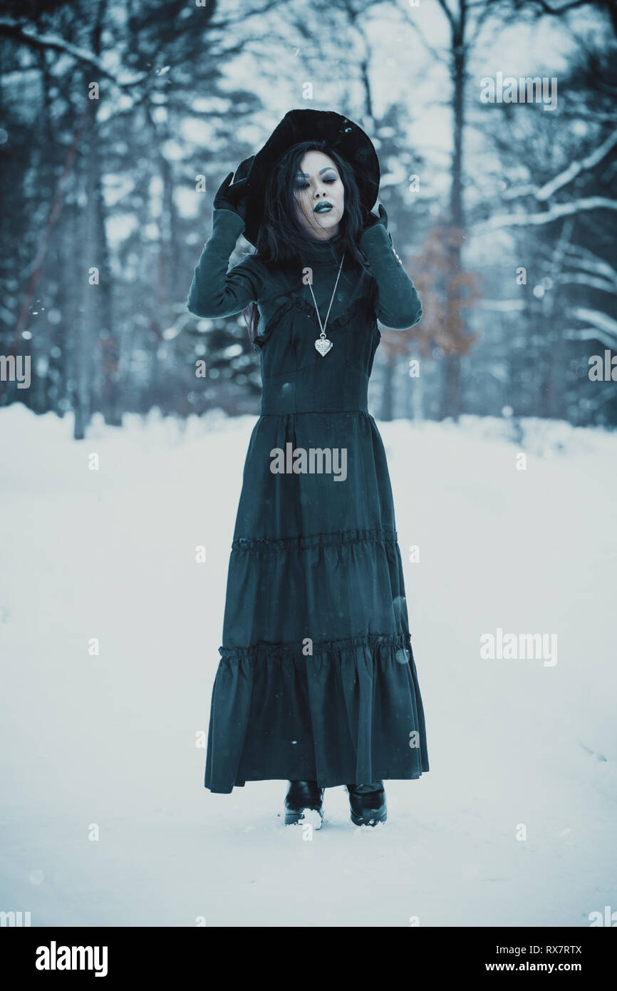 Asian gothic goth girl at snowy winter outdoors Stock Photo - Alamy
