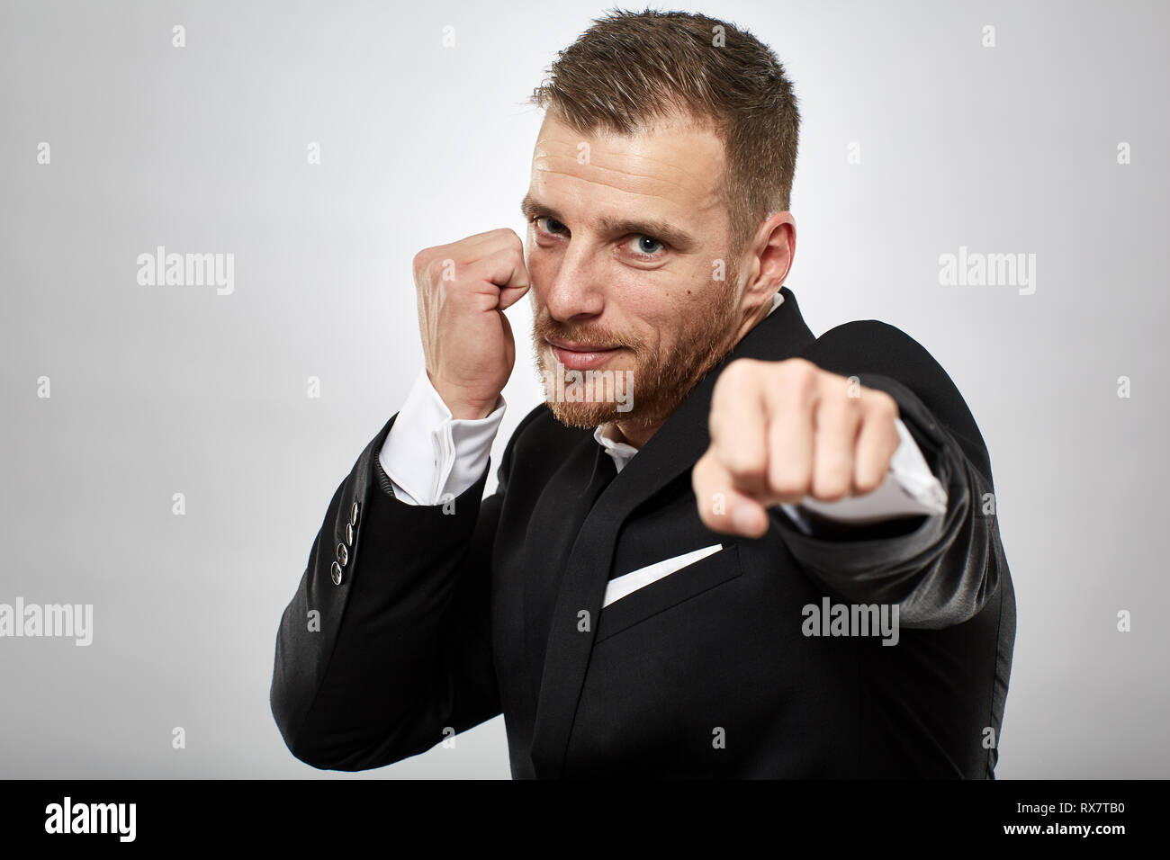 Conceptual image of a combative businessman ready to fight Stock Photo ...