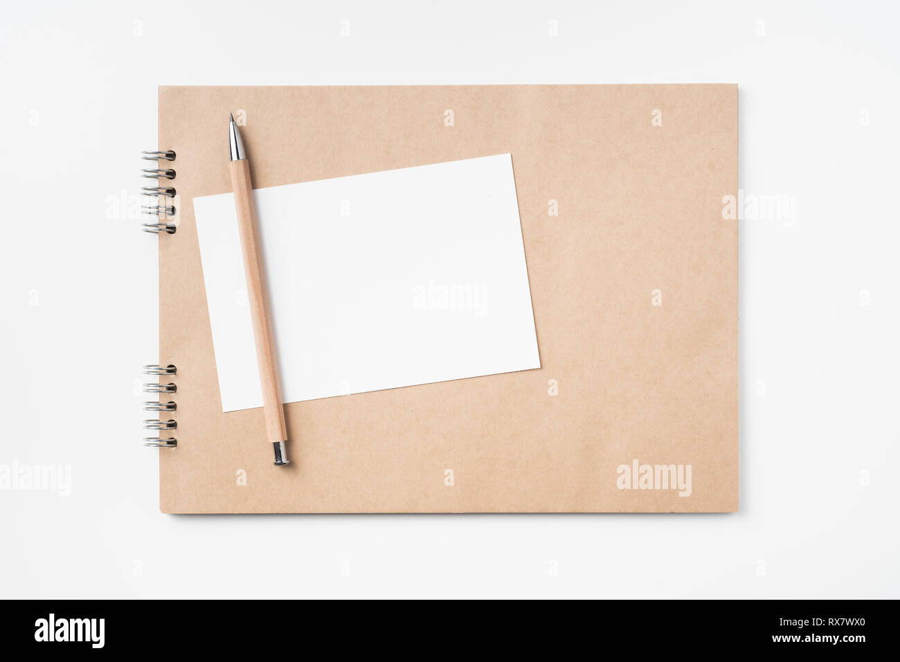 Design concept - Top view of kraft notebook, photo frame and pen ...