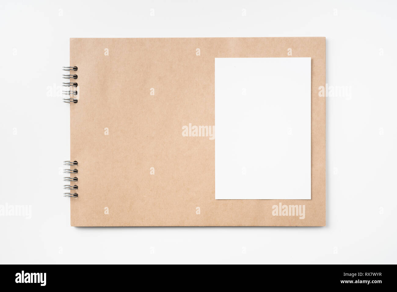 Design concept - Top view of kraft notebook, photo frame and pen ...
