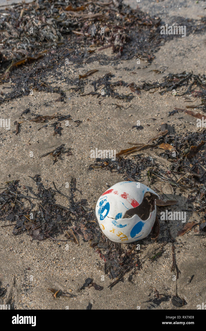 Broken / split beach ball. An example of seashore plastic pollution in ...