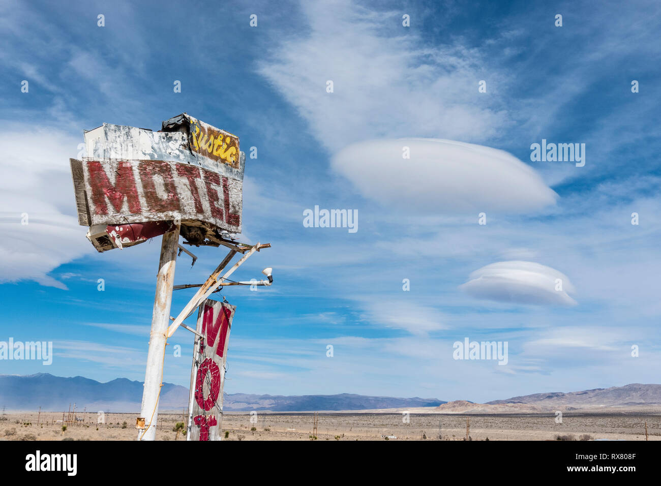 The Rustic Oasis Motel sign with a lenticular cloud formation behind it ...