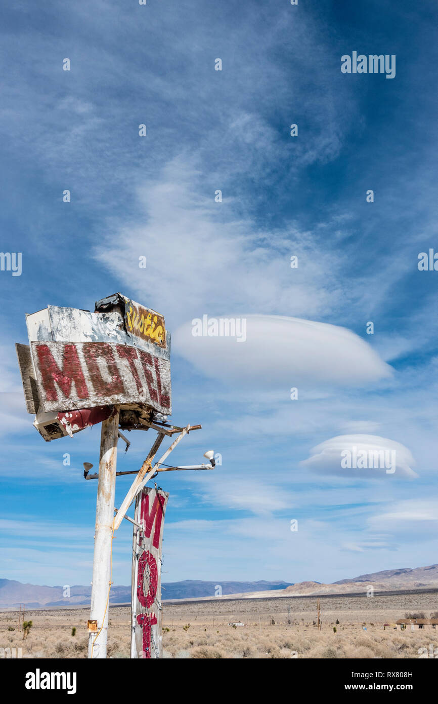 The Rustic Oasis Motel sign with a lenticular cloud formation behind it ...