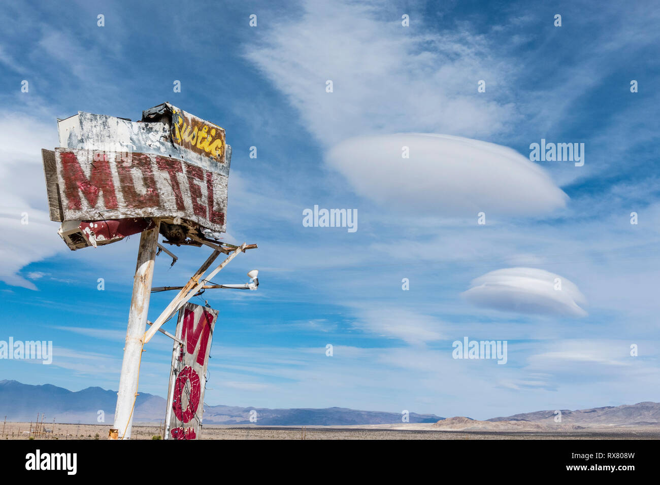 The Rustic Oasis Motel sign with a lenticular cloud formation behind it ...