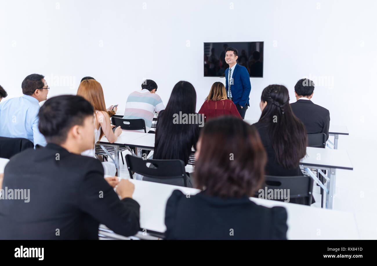 businessman presentation in a conference meeting room and Audience of ...