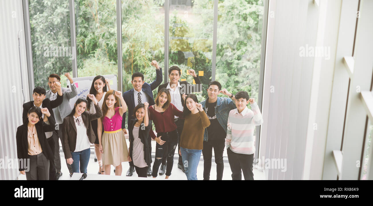 Group of asian business team raising arms success achievement Concept ...