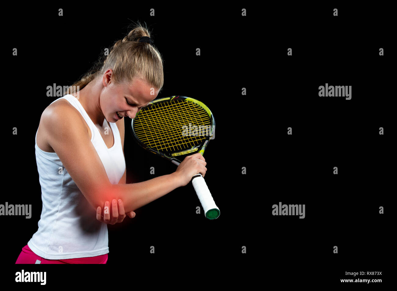 tennis woman player with injury holding the racket on a tennis court ...