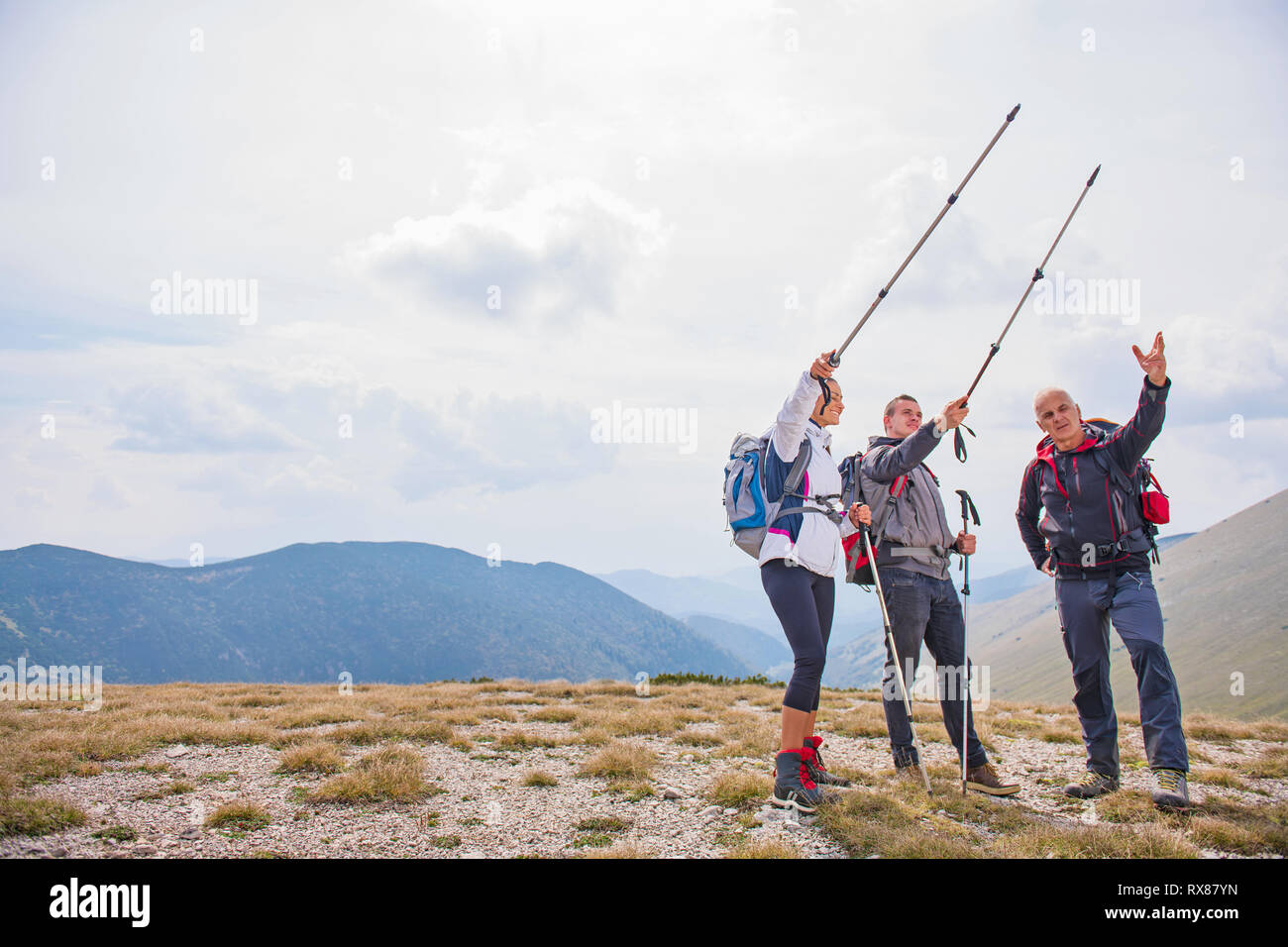 An elderly man giving a tour for a young group of people Stock Photo ...