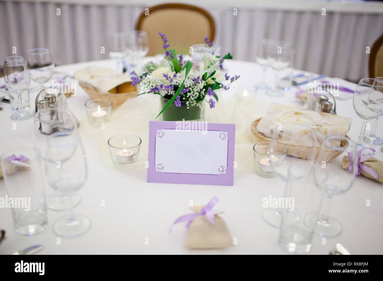 Wedding decorated table with empty panel with purple frame Stock Photo ...