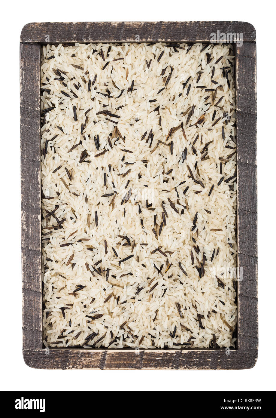 Wooden box of raw organic basmati long grain and wild rice on white ...