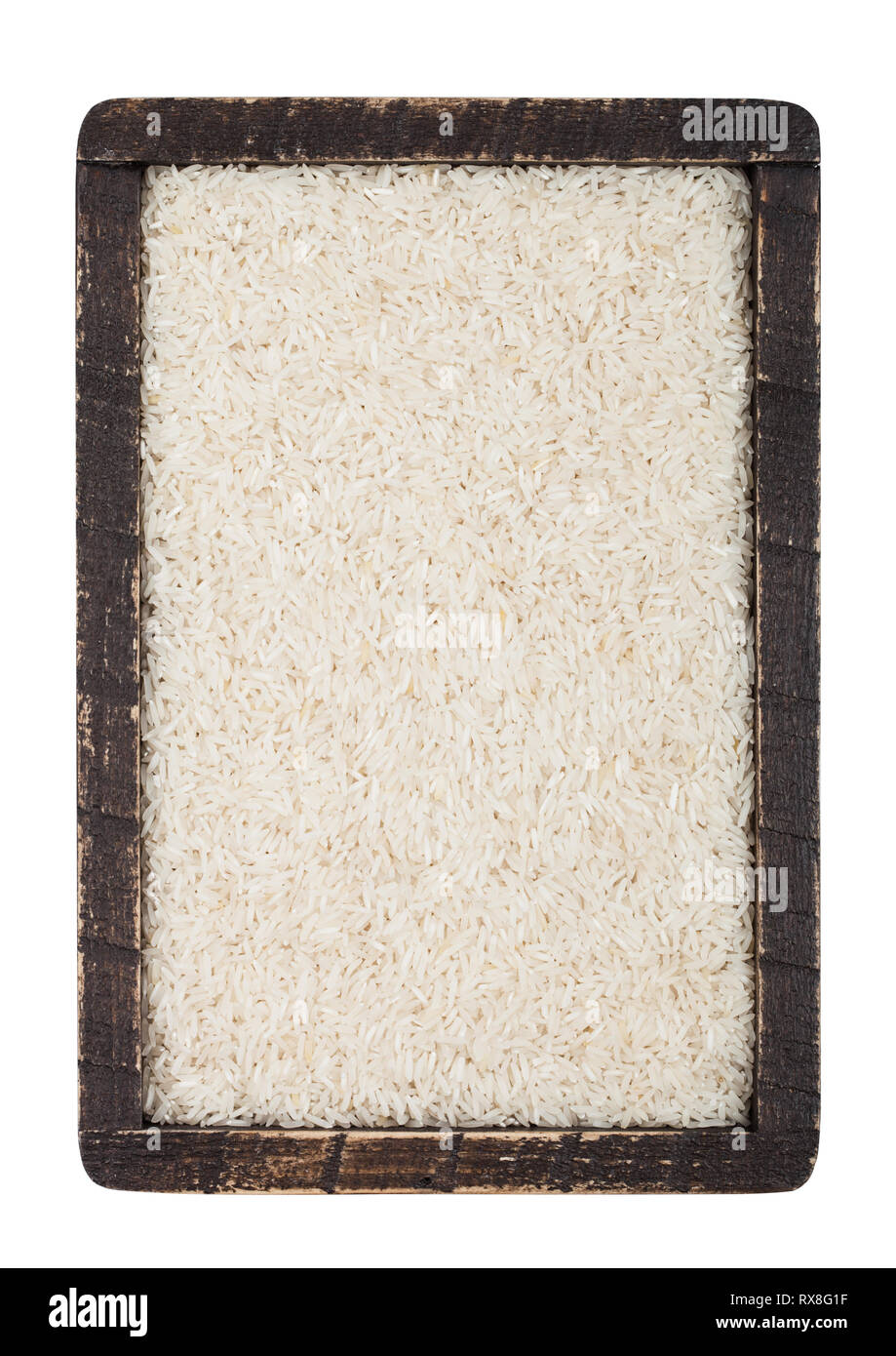 Wooden box of raw organic basmati rice on white background. Top view ...