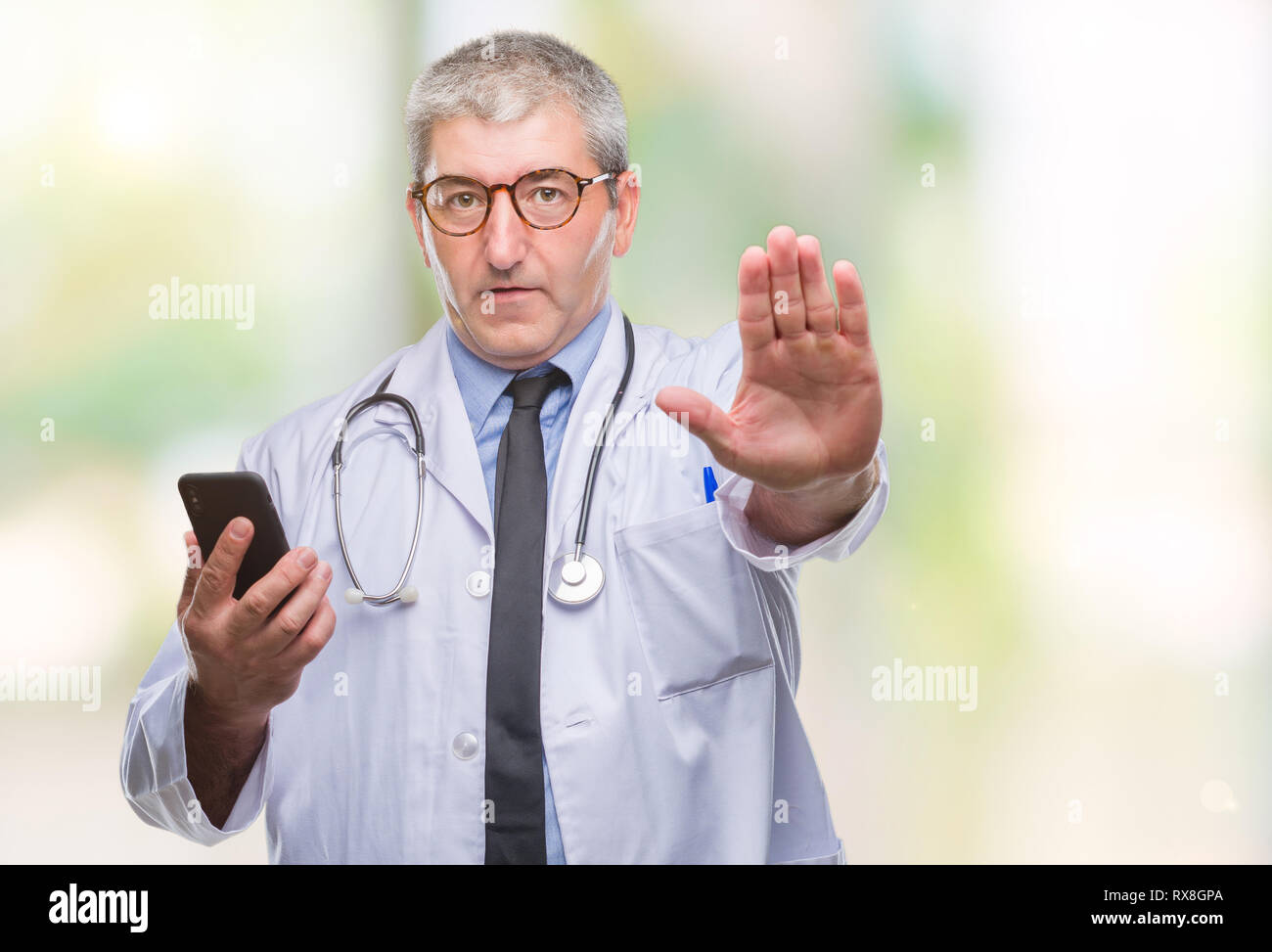 Doctor warning portrait mature hi-res stock photography and images - Alamy