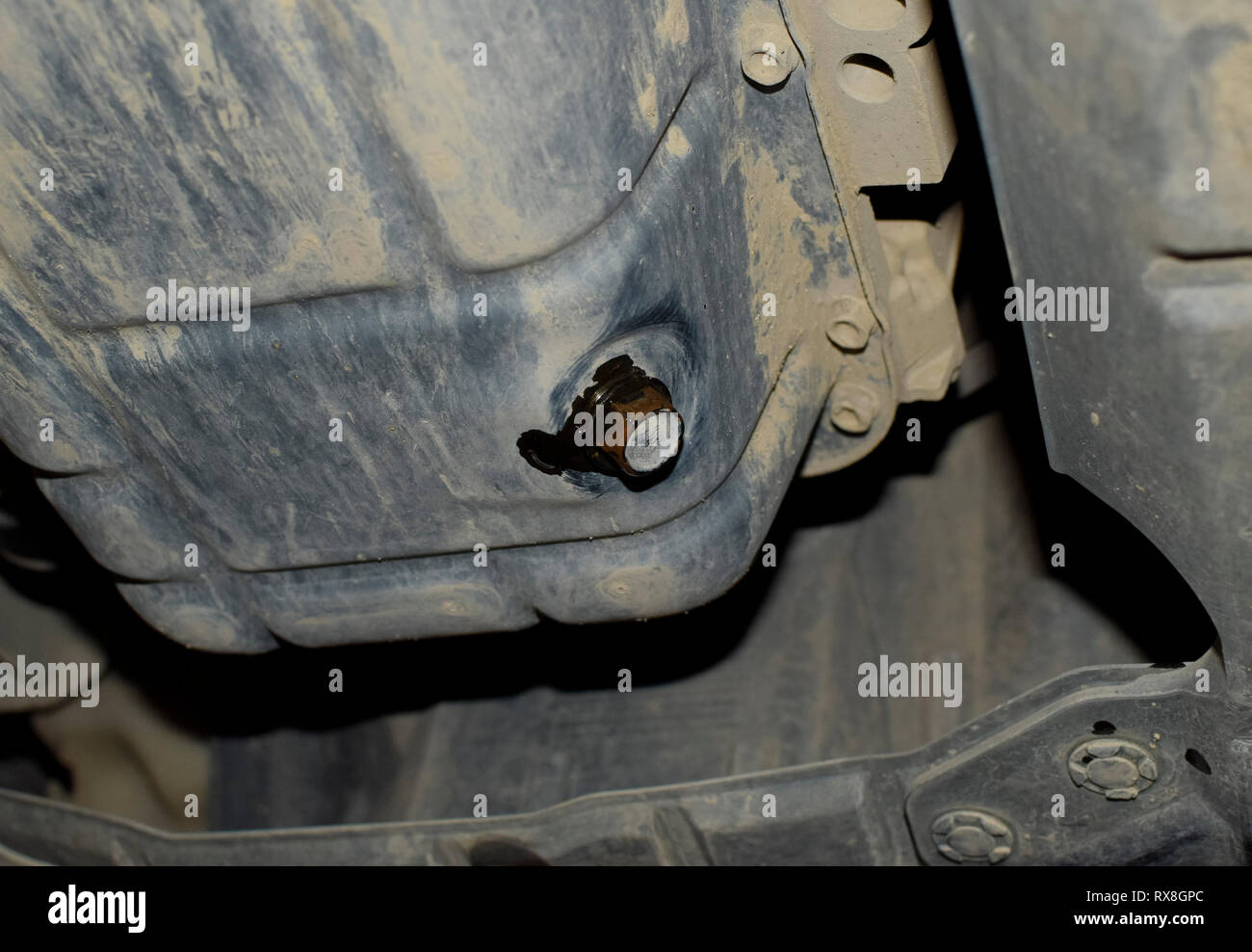 Drain the old oil from the engine through the drain plug. Changing the ...