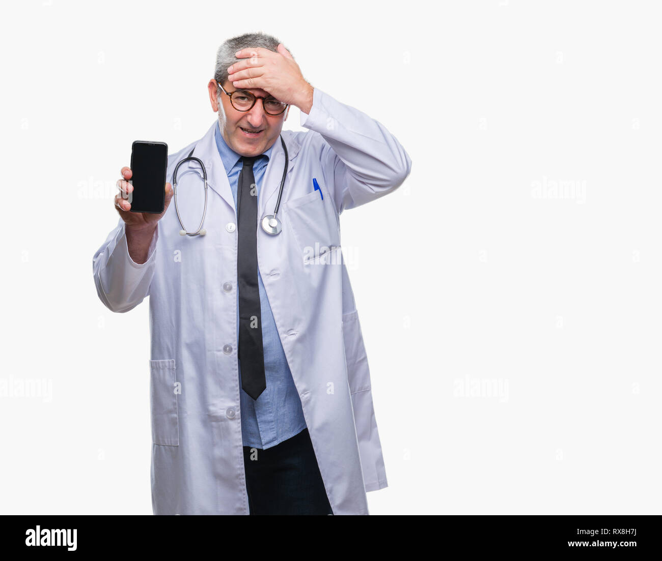 Handsome senior doctor man showing screen of smarpthone over isolated ...