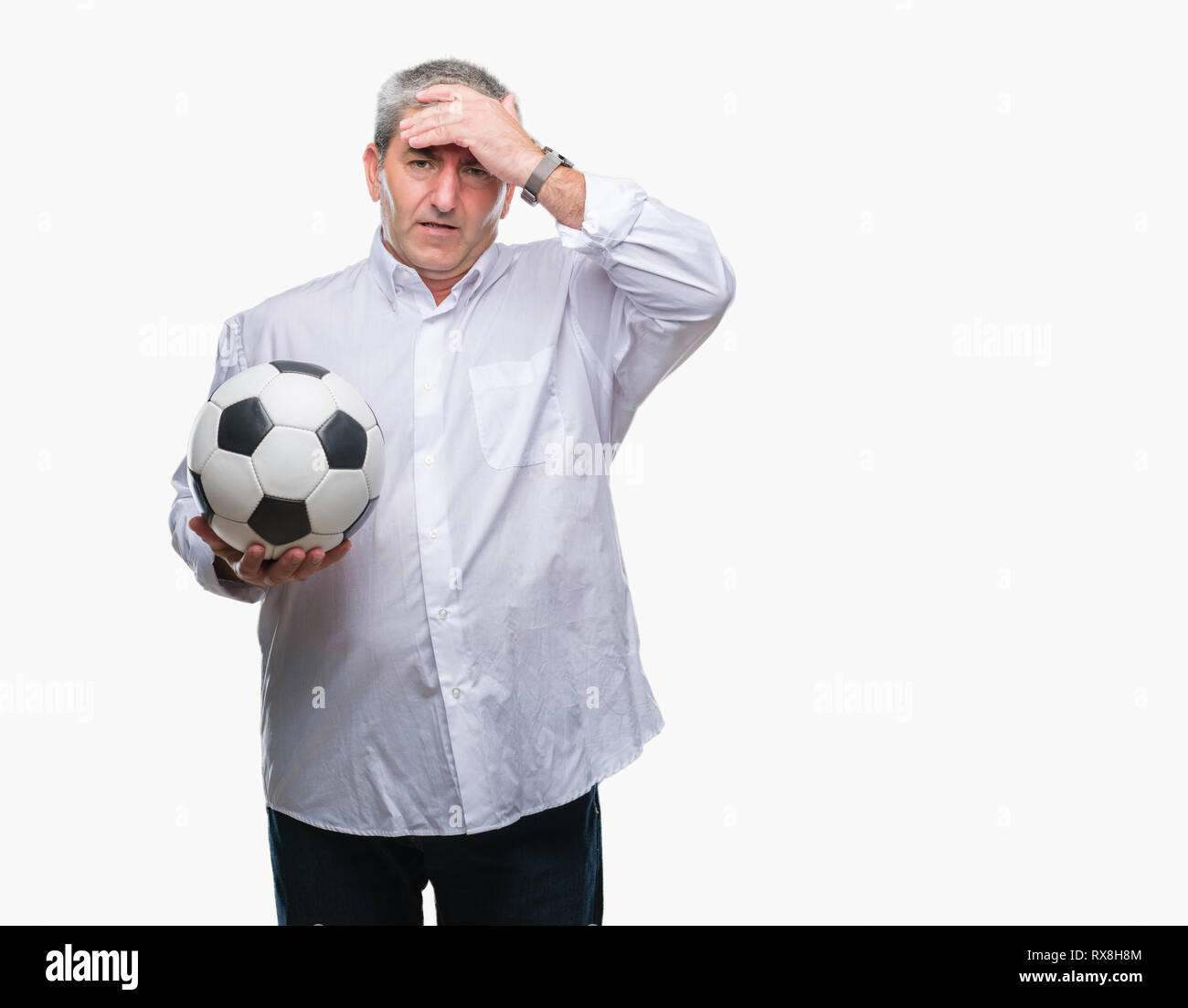 Handsome senior man holding soccer football ball over isolated ...