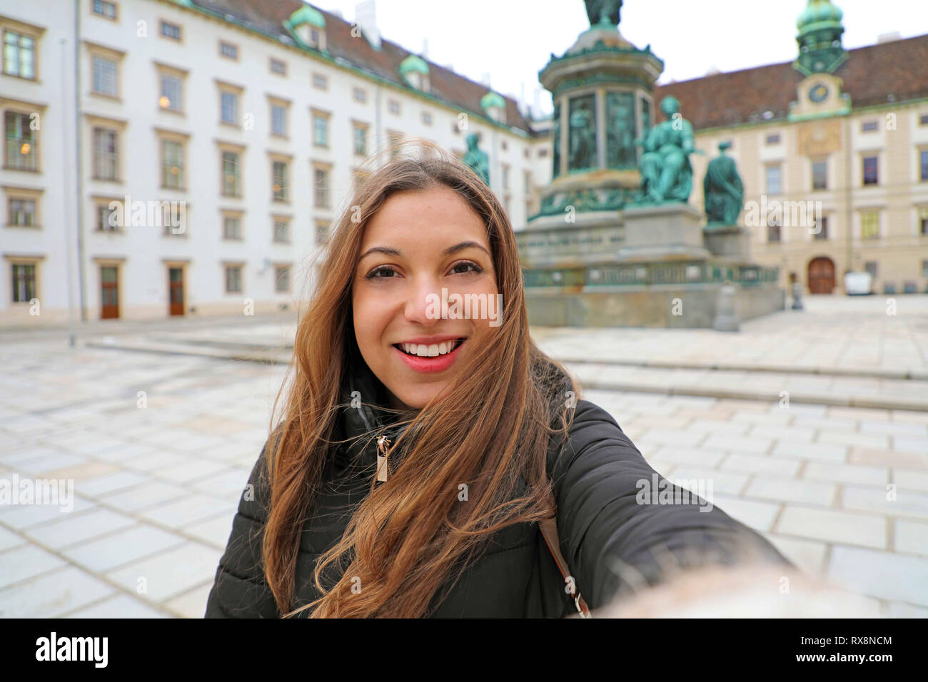 Happy cheerful woman in Vienna at winter time. Travel in Europe girl ...