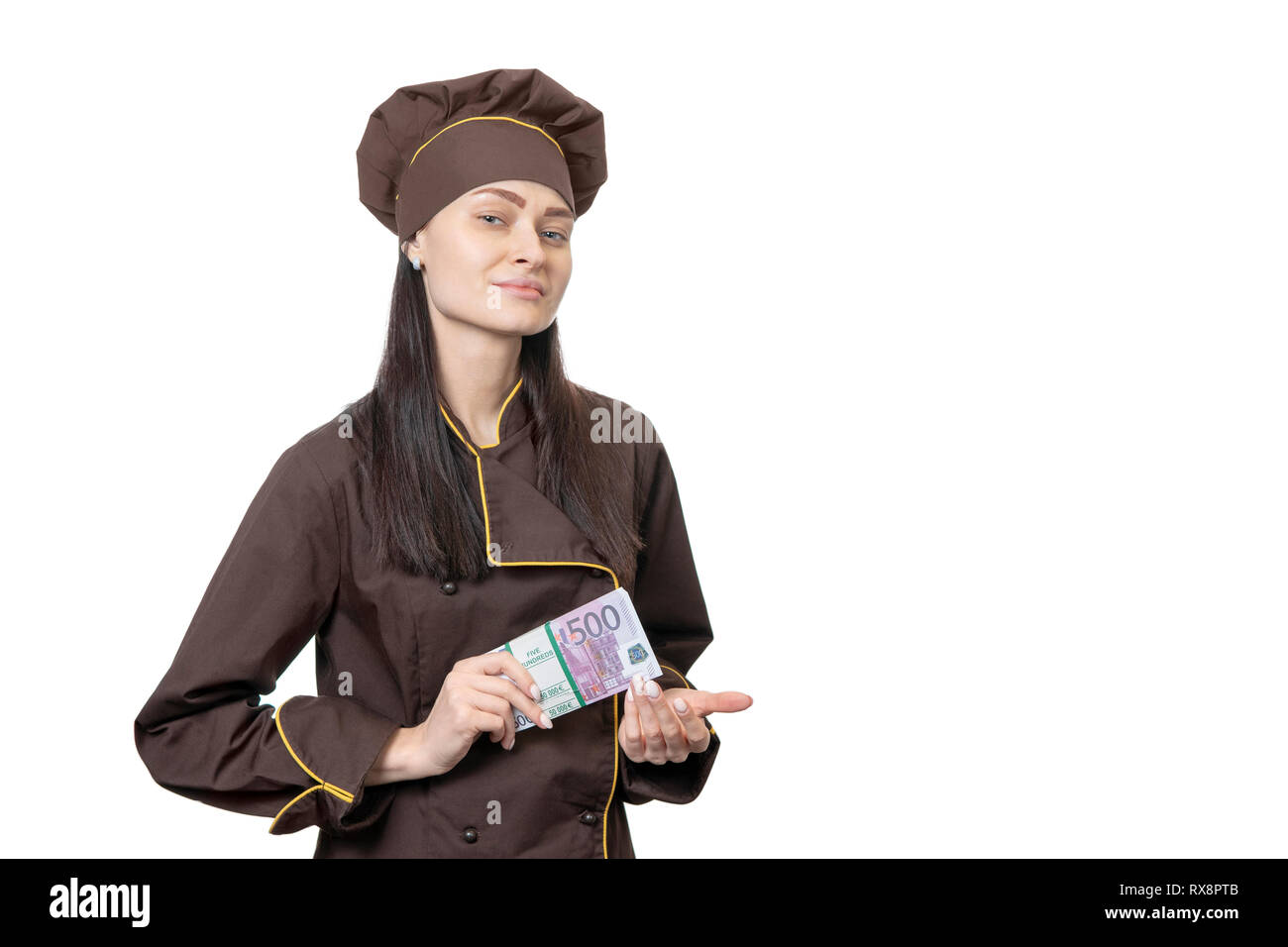 chef holding a pack of five hundred euro money isolated on white ...