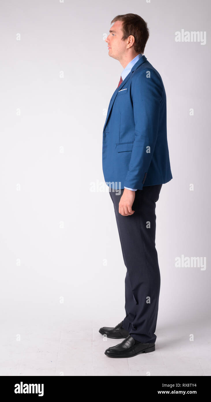Full body shot profile view of businessman wearing suit Stock Photo - Alamy
