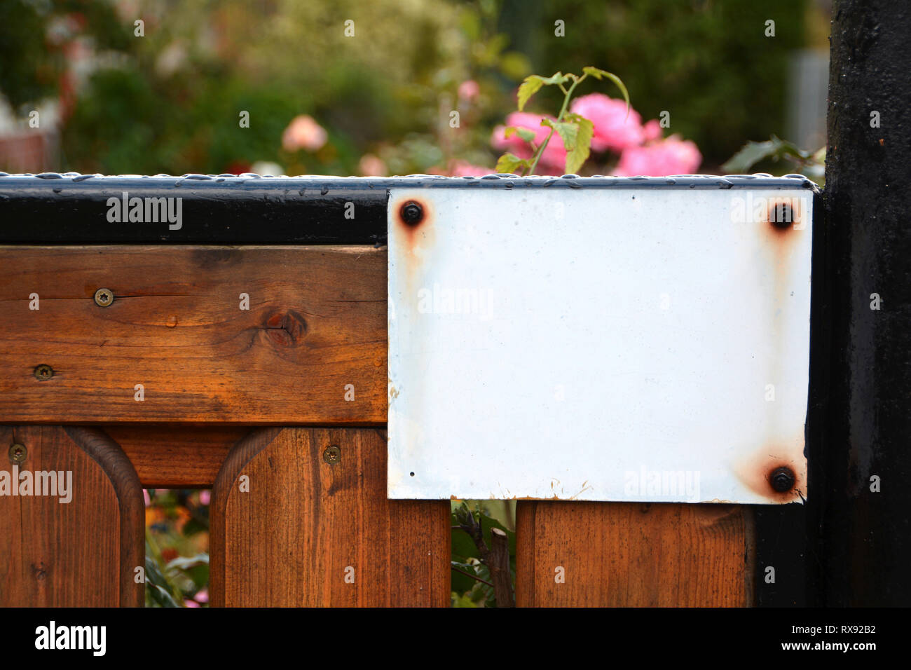 empty signboard with copy space at the garden fence Stock Photo - Alamy