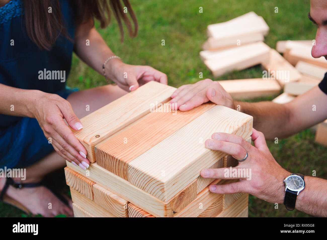 Giant Outdoor Block Game, game on green grass Stock Photo - Alamy