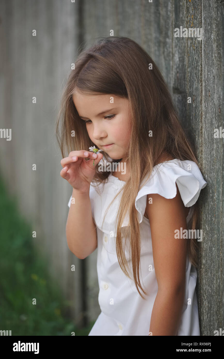happy little girl with long hair Stock Photo - Alamy