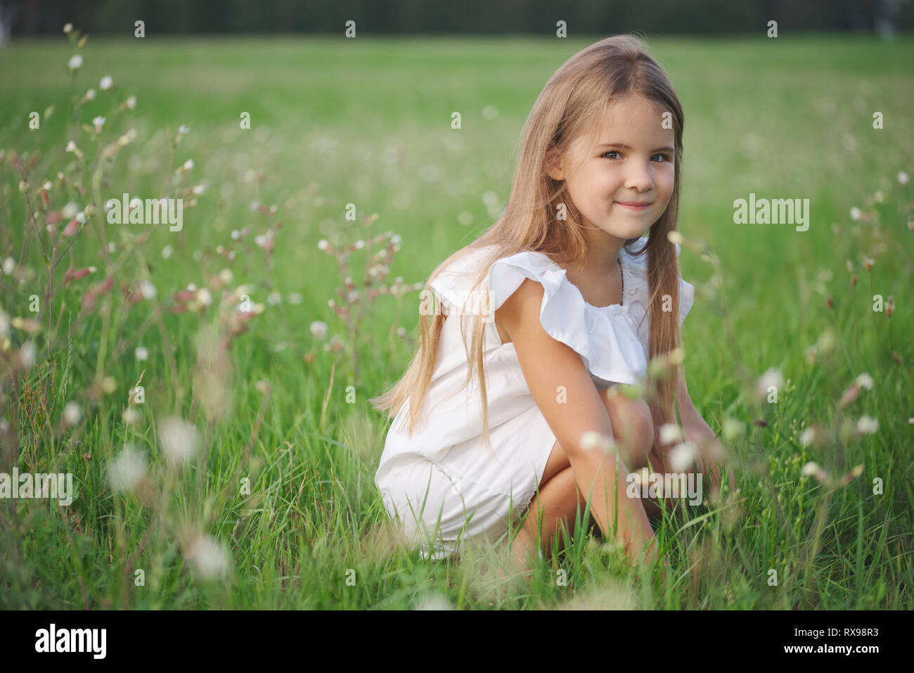 happy little girl with long hair Stock Photo - Alamy