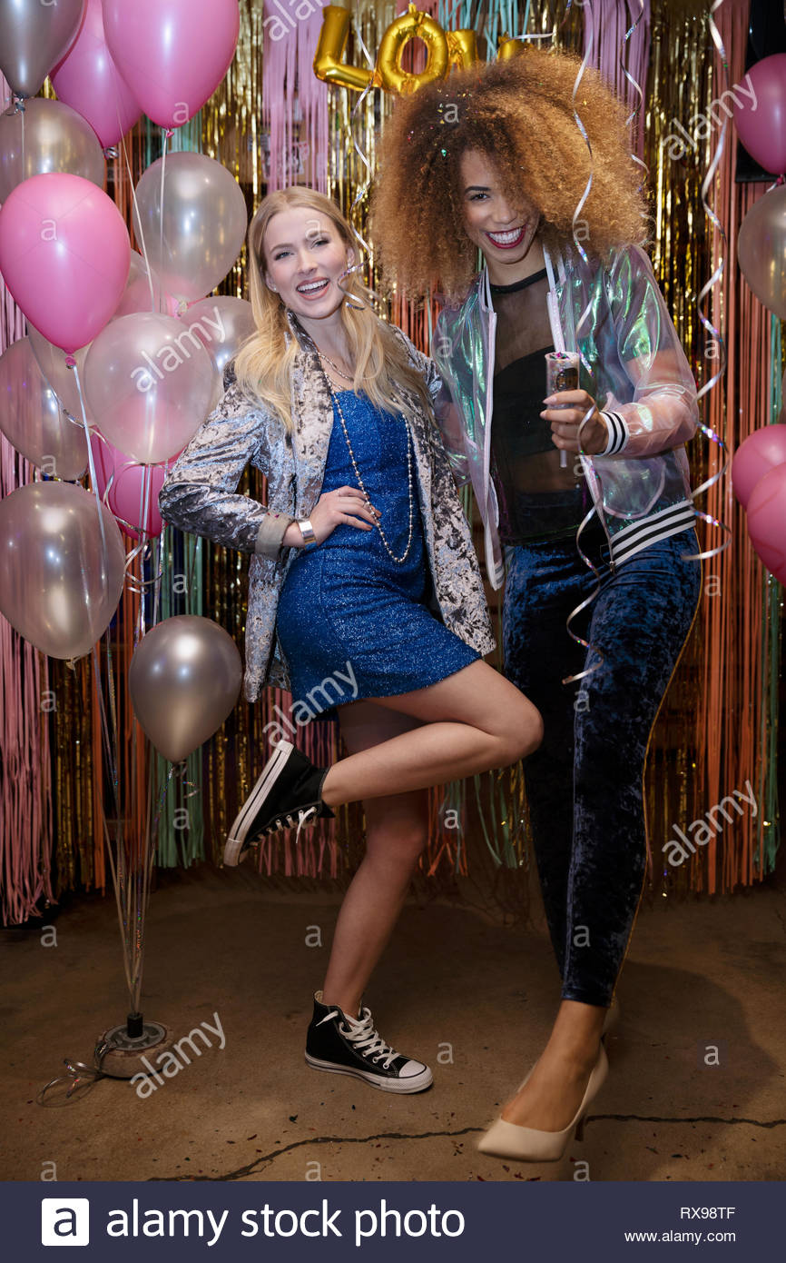 Two young people standing photo booth hi-res stock photography and ...