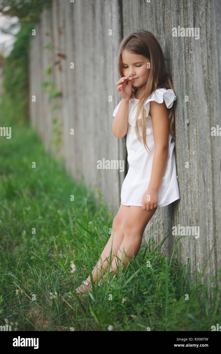 happy little girl with long hair Stock Photo - Alamy